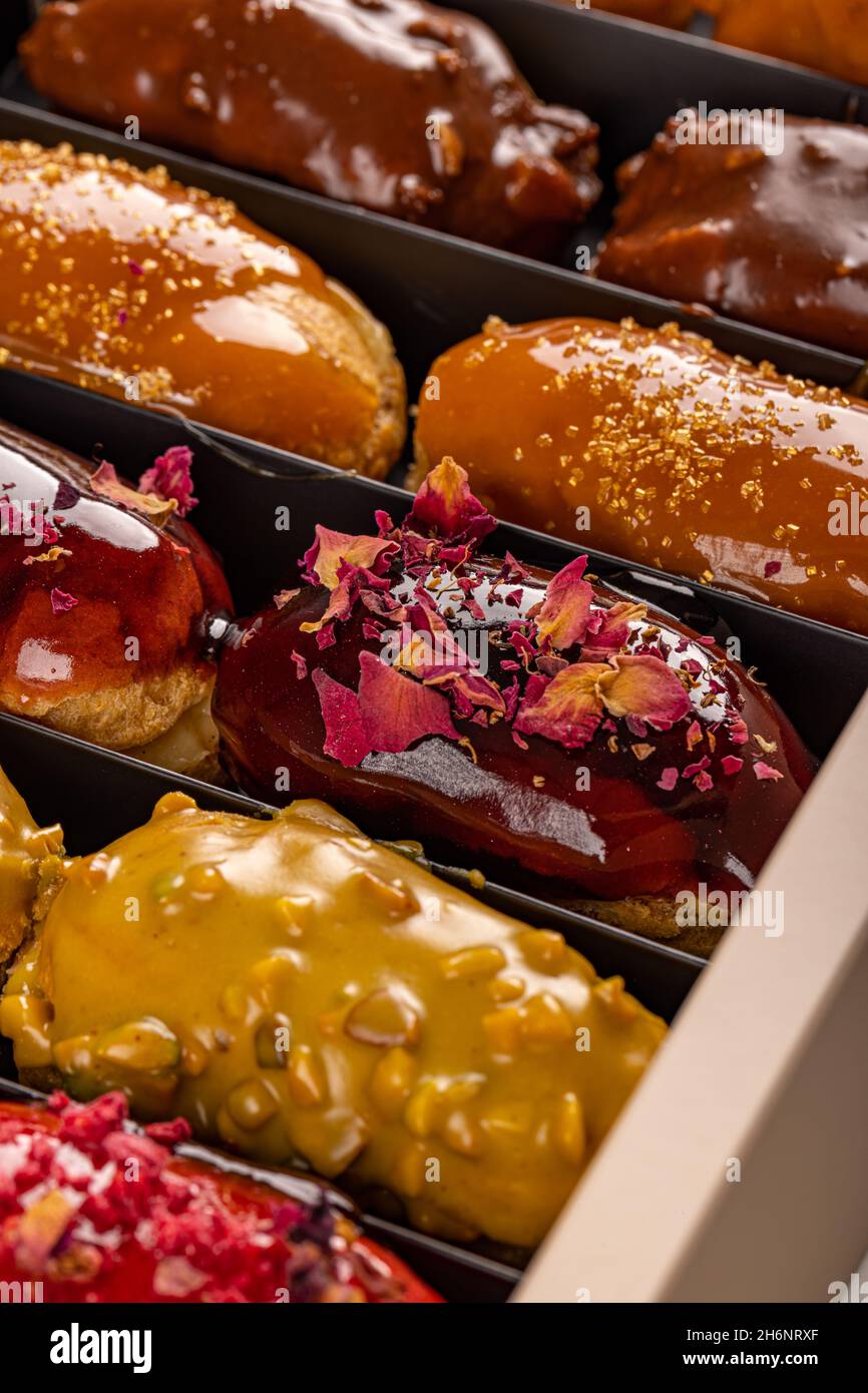 Glazed mini eclairs with different flavor, close up Stock Photo - Alamy