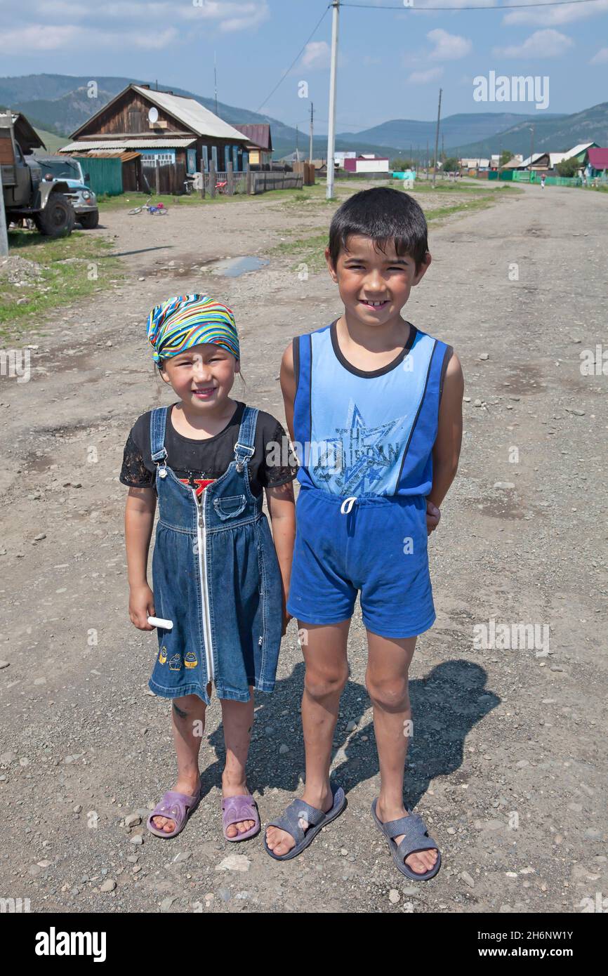 Buryat children, 8 and 5 years old, on the main street of Bolshoye ...