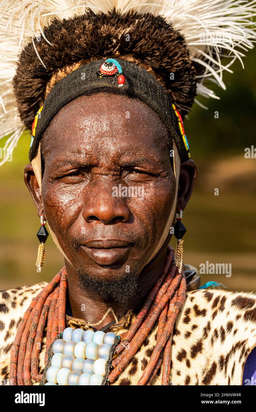 Man from the Toposa tribe posing in his traditional warrior costume ...