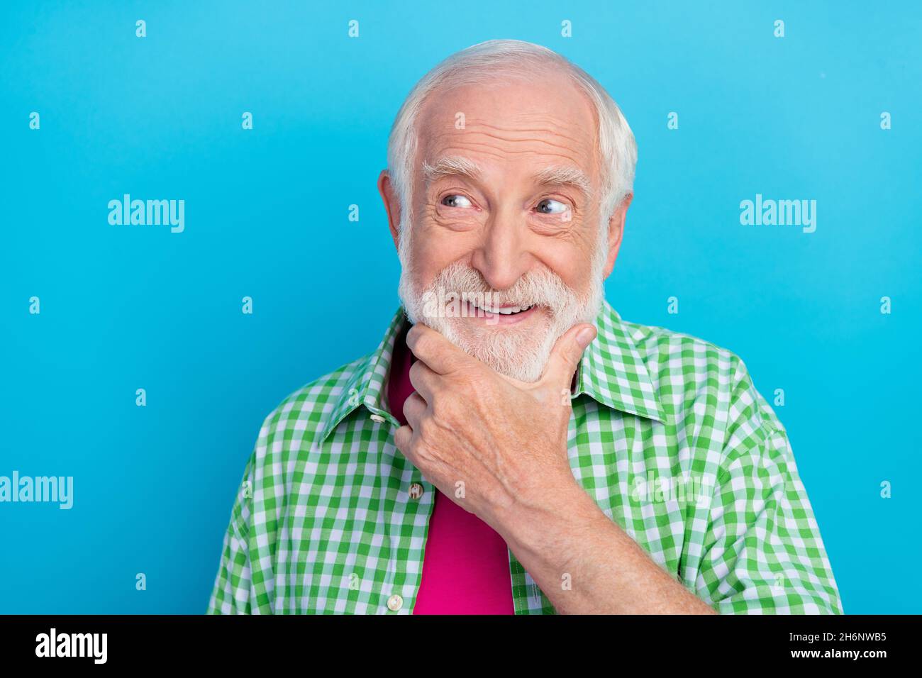 Photo of positive happy minded old man look empty space creative plan ...