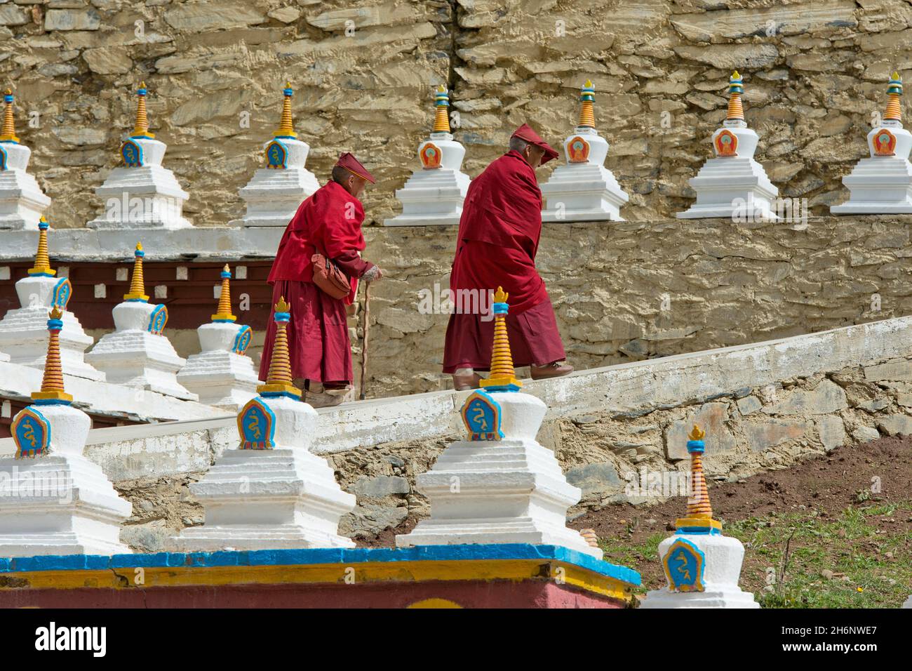 Two elderly nuns chatting during the morning circumnavigation, Tibetan ...