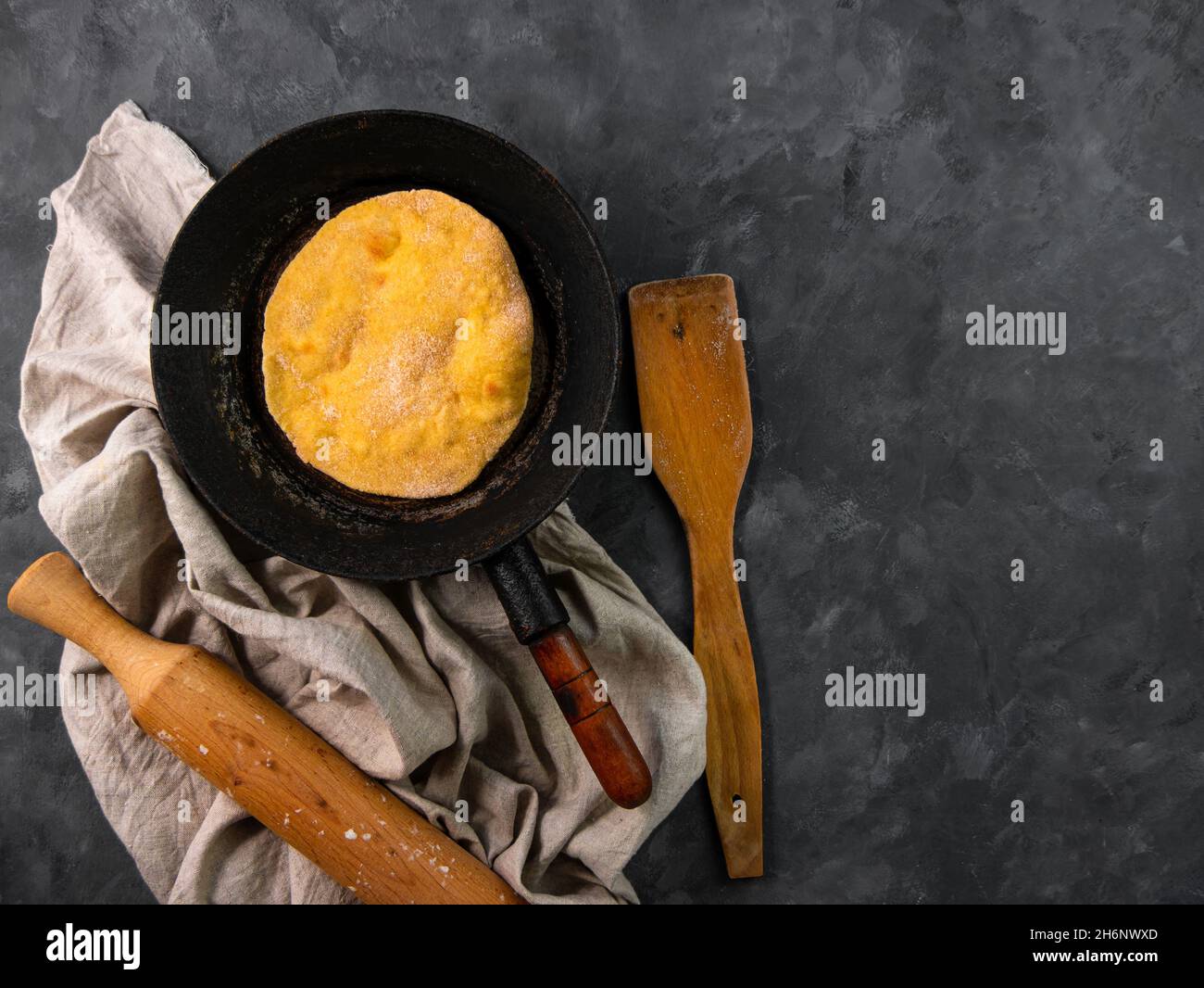Homemade corn flatbread meal on frying pan linen cloth. Handmade ...