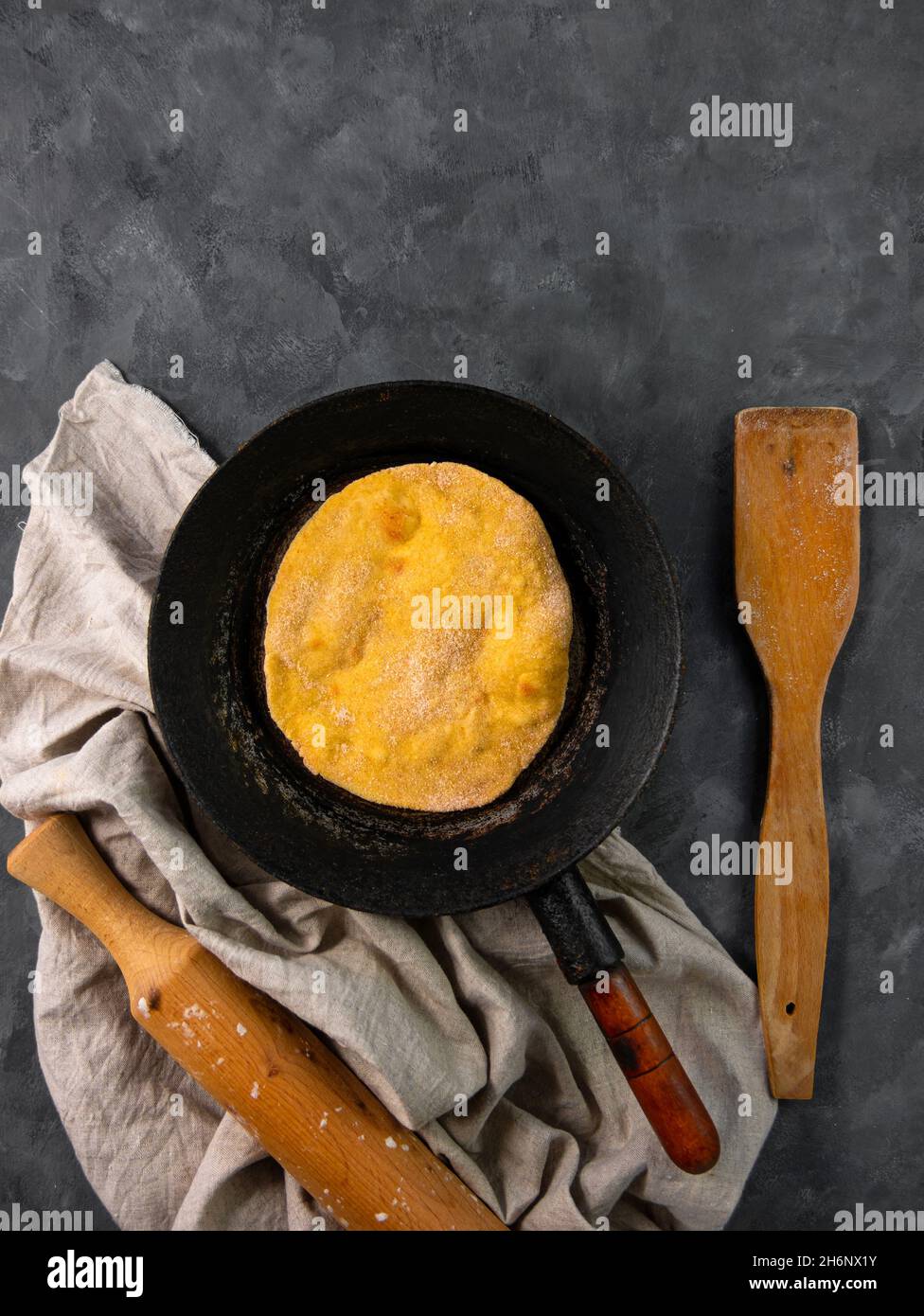 Homemade corn flatbread meal on frying pan linen cloth. Handmade ...