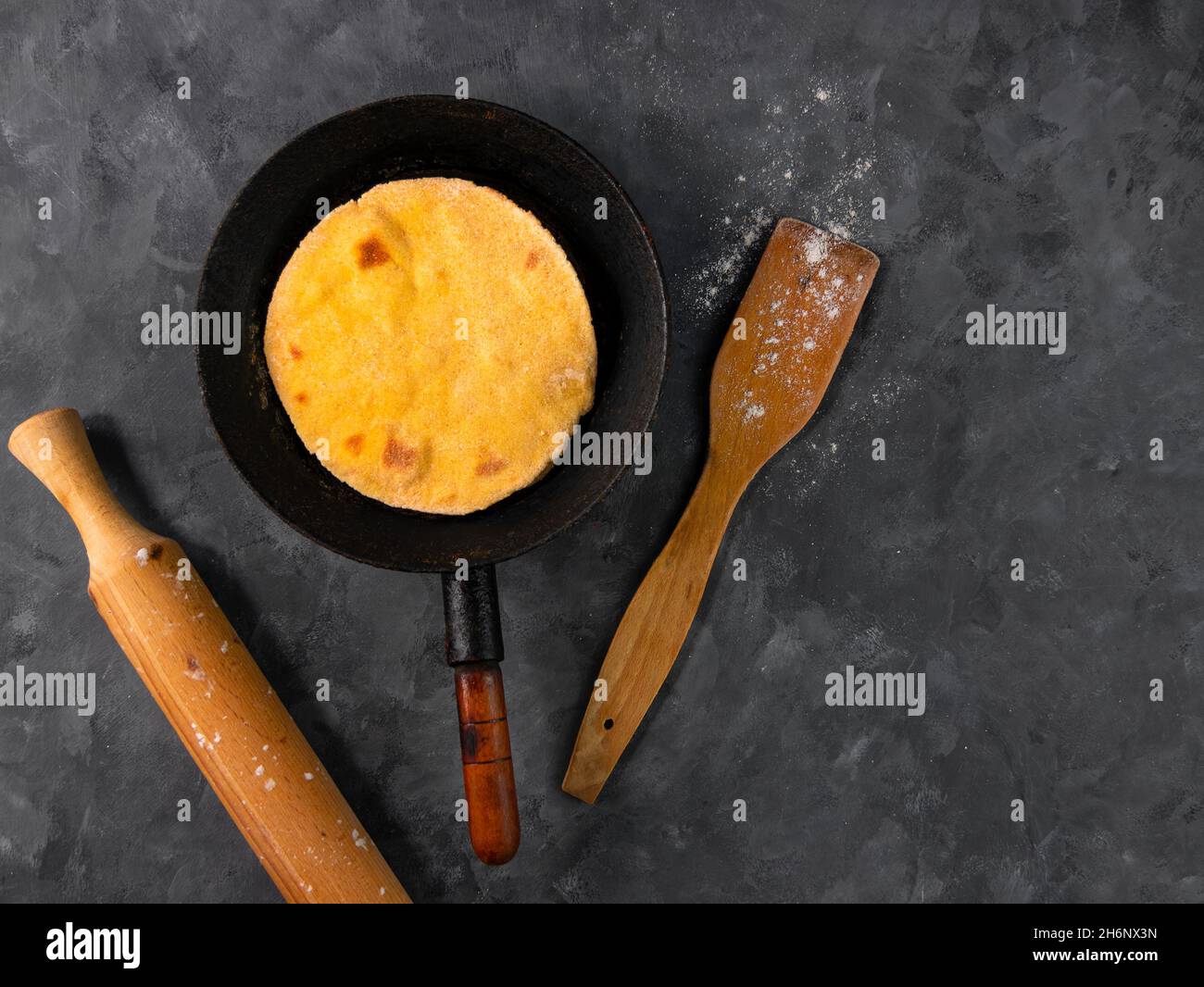 Homemade flatbread meal frying pan corn flour rolling pin. Handmade ...