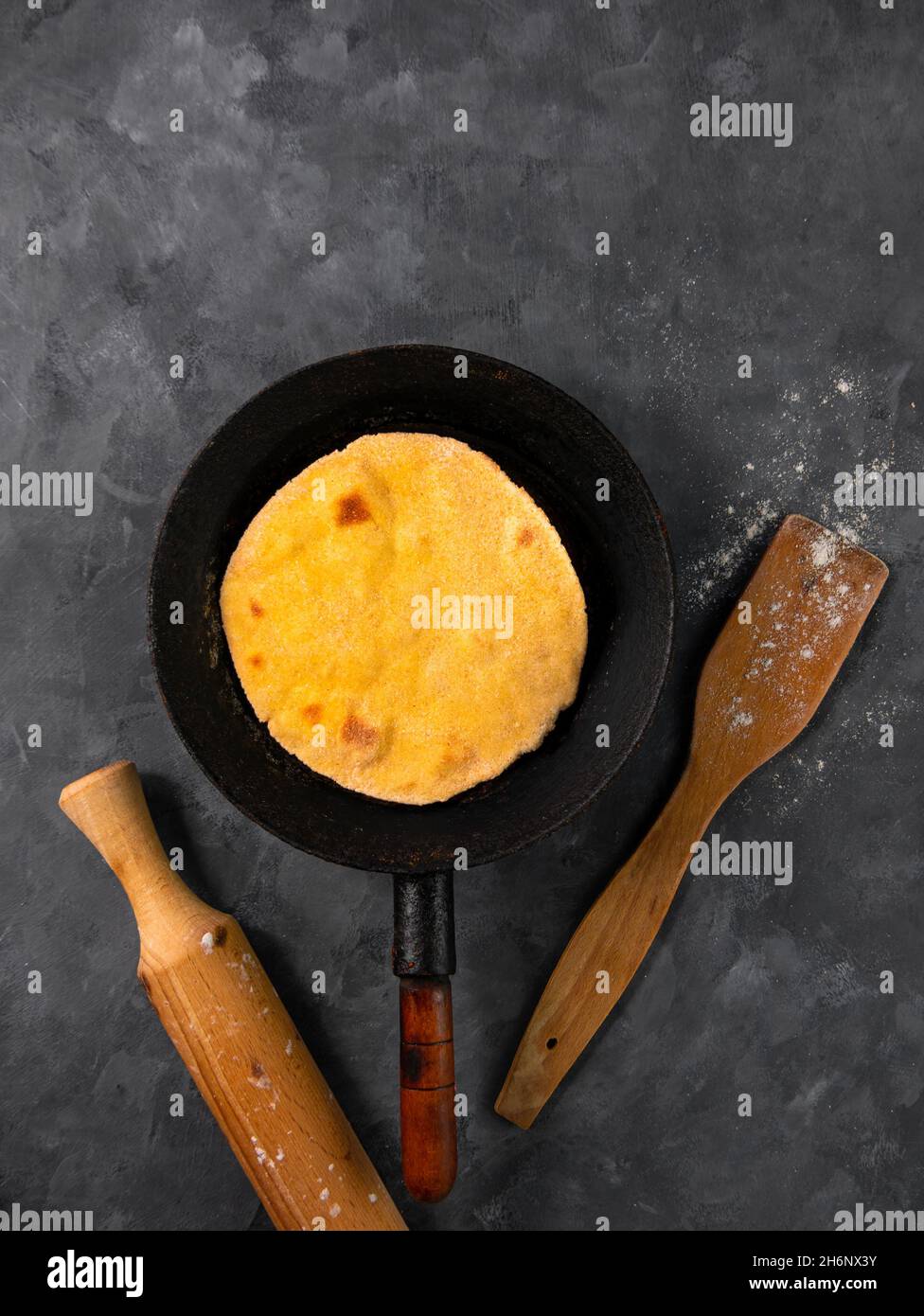 Homemade flatbread meal frying pan corn flour rolling pin. Handmade ...
