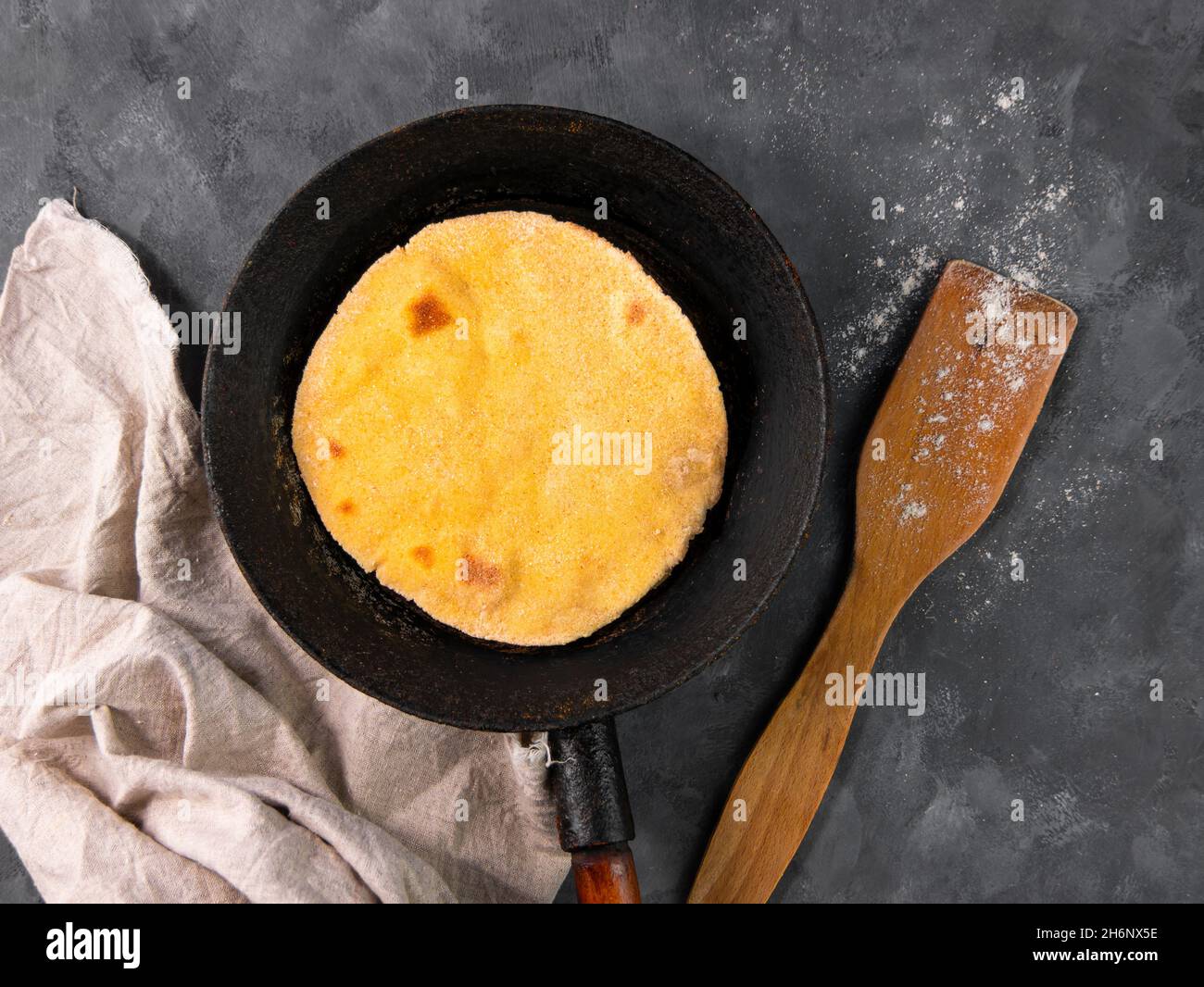 Homemade corn flatbread meal on frying pan linen cloth. Handmade ...
