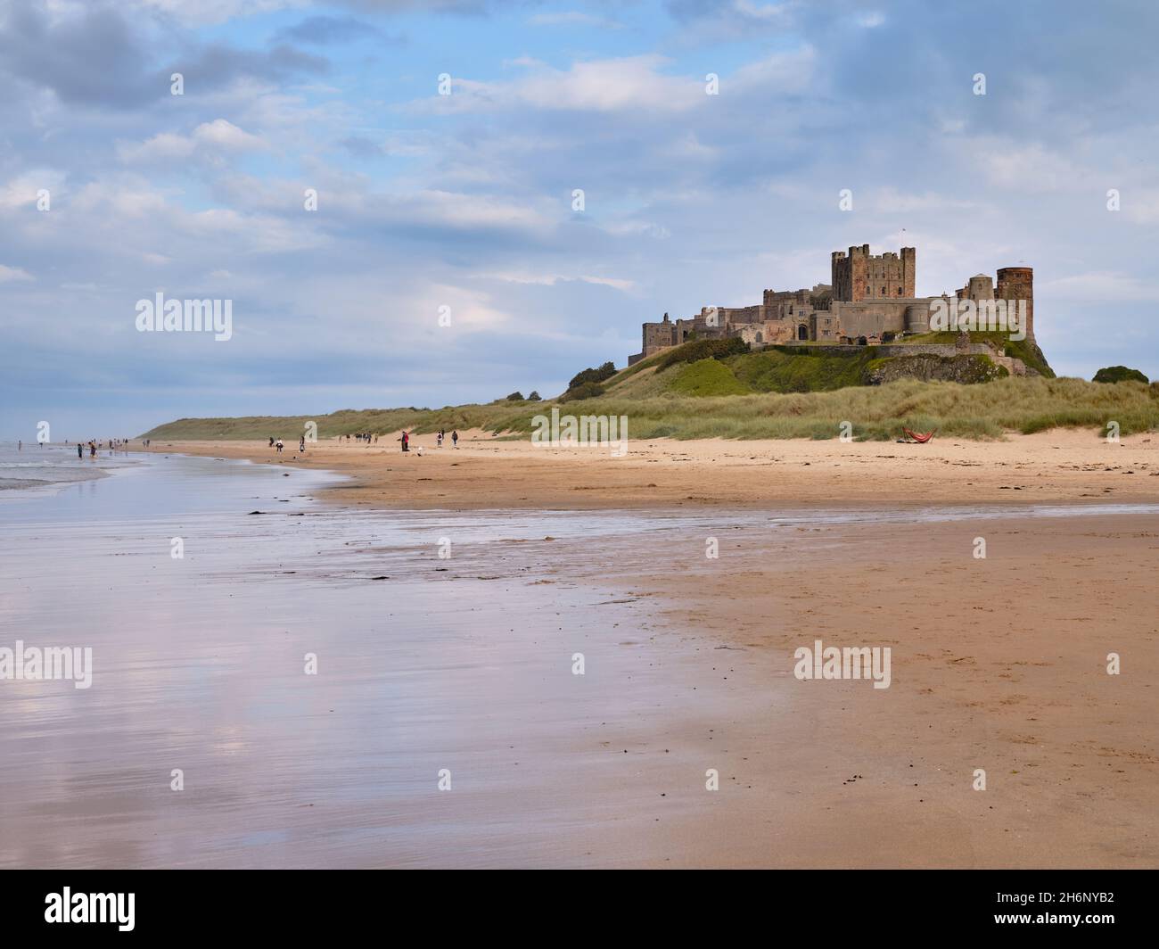 The summer landscape of Bamburgh beach and castle on the Northumberland ...