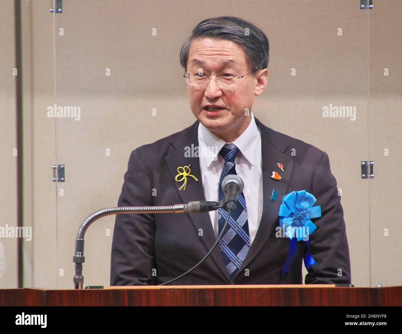Governor of Tottori Shinji Hirai speaks during a rally of families of ...