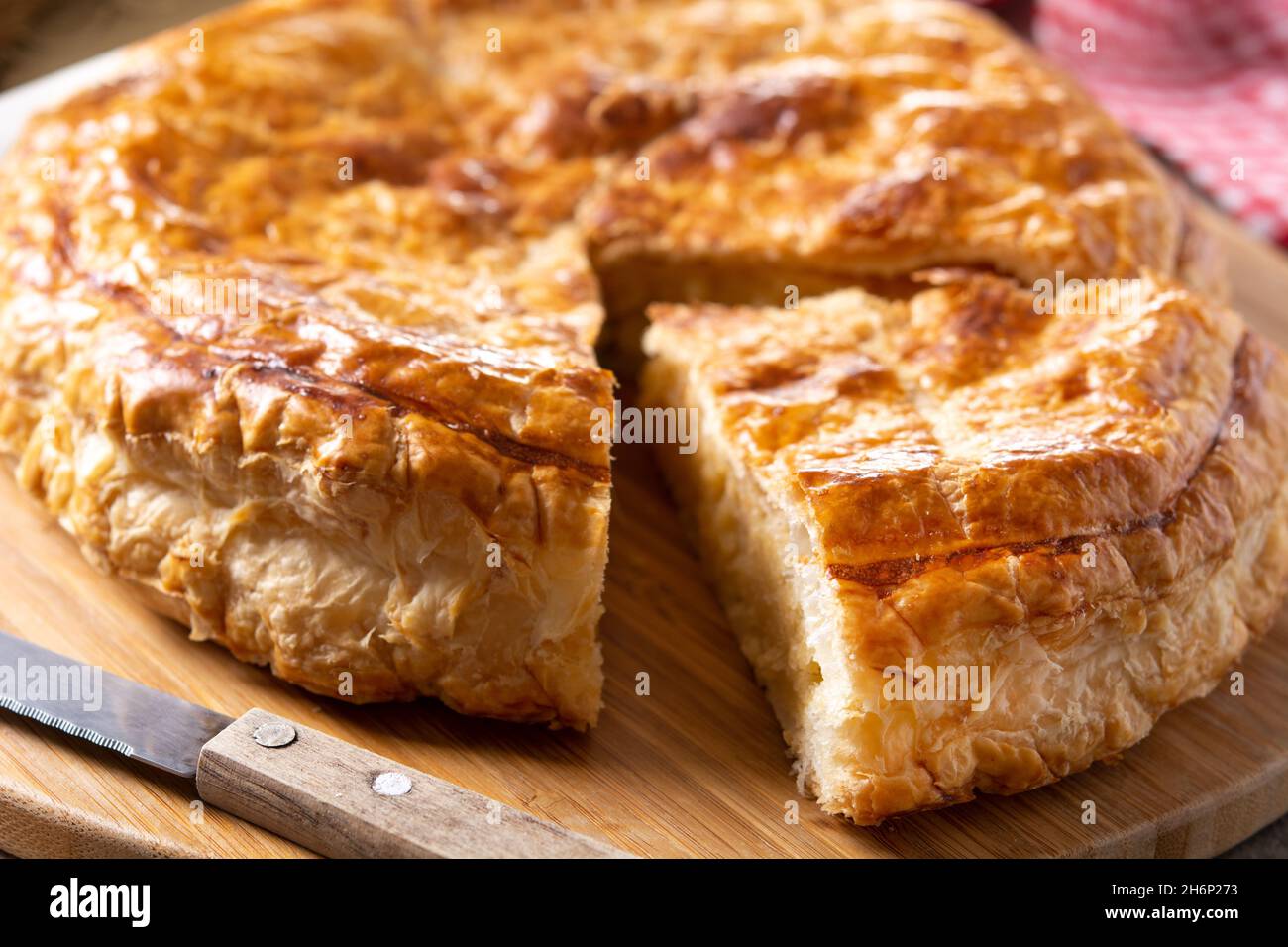 Galette des rois on wooden table. Traditional Epiphany cake in France ...