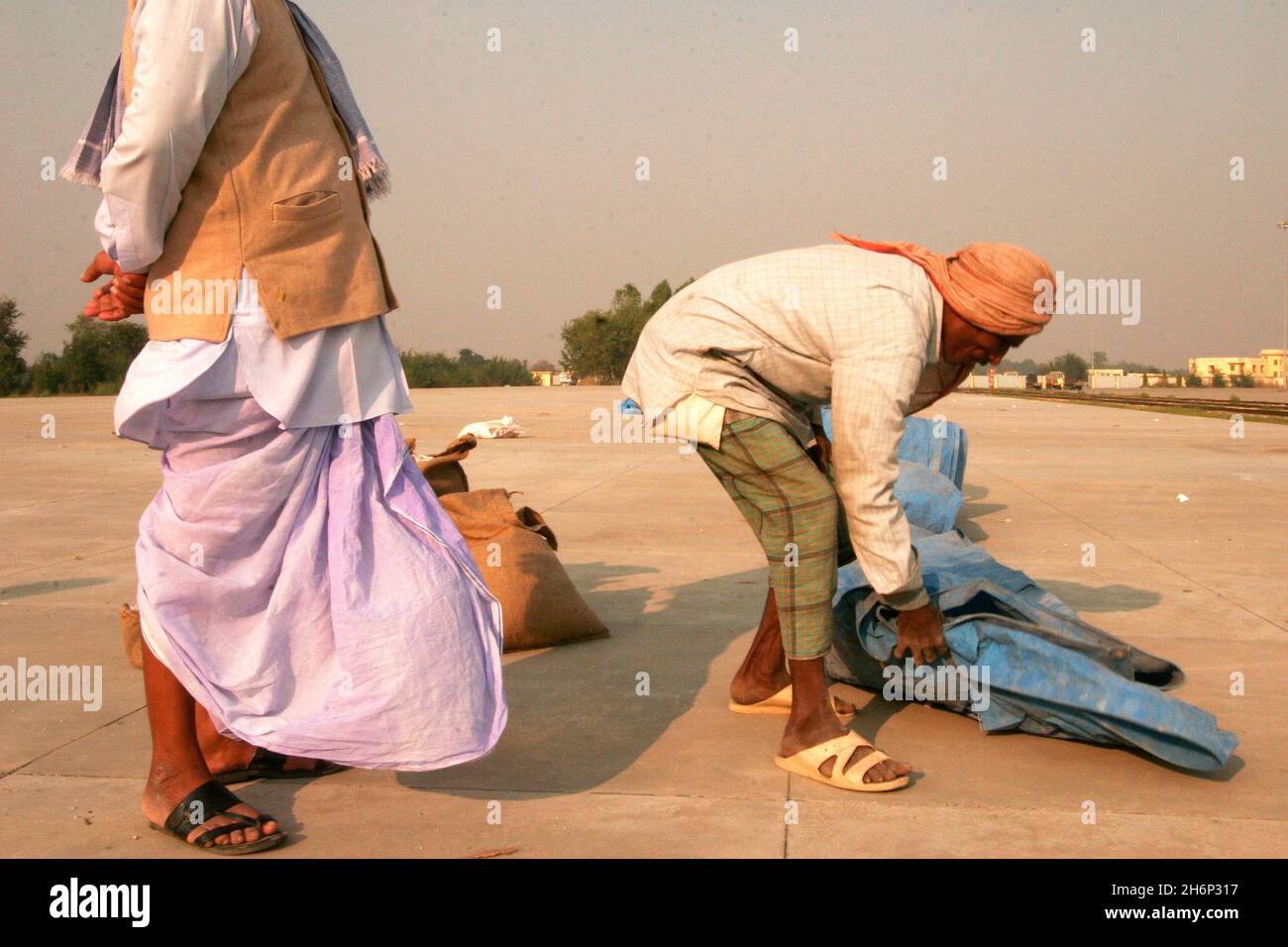 Two men carrying heavy goods. Nepal Stock Photo - Alamy