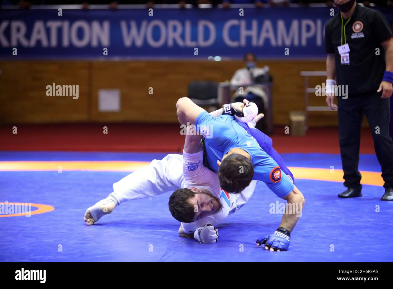 KHARKIV, UKRAINE - NOVEMBER 16, 2021 - Athletes wrestle on the mat ...