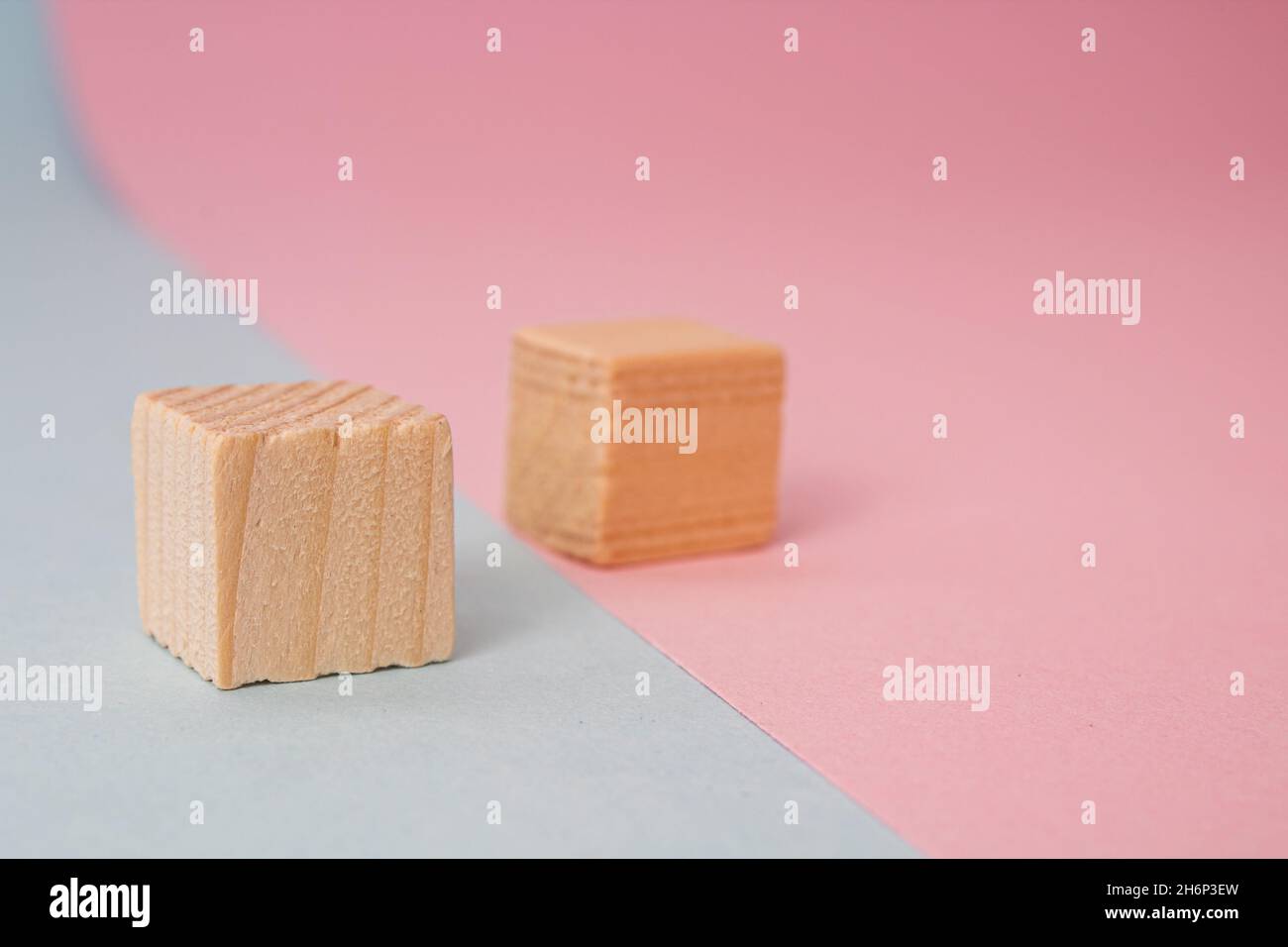Closeup of the wooden blocks on pink and gray background Stock Photo ...