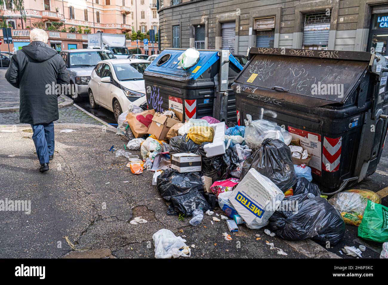 ROME ITALY, 17 November 2021. Pedestrians walk past waste and recycling ...