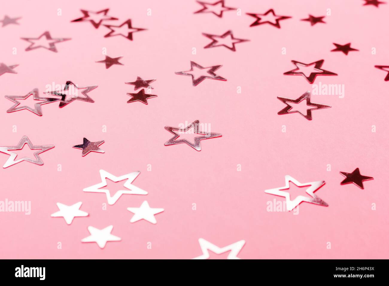 Festive pastel pink background with metallic confetti Stock Photo - Alamy