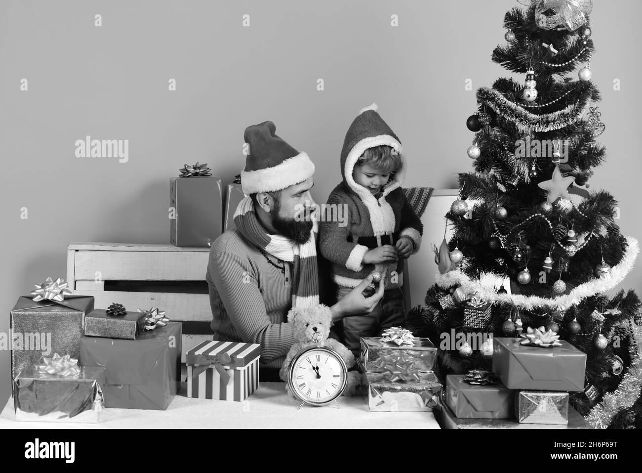 Boy and man with beard and serious faces Stock Photo - Alamy