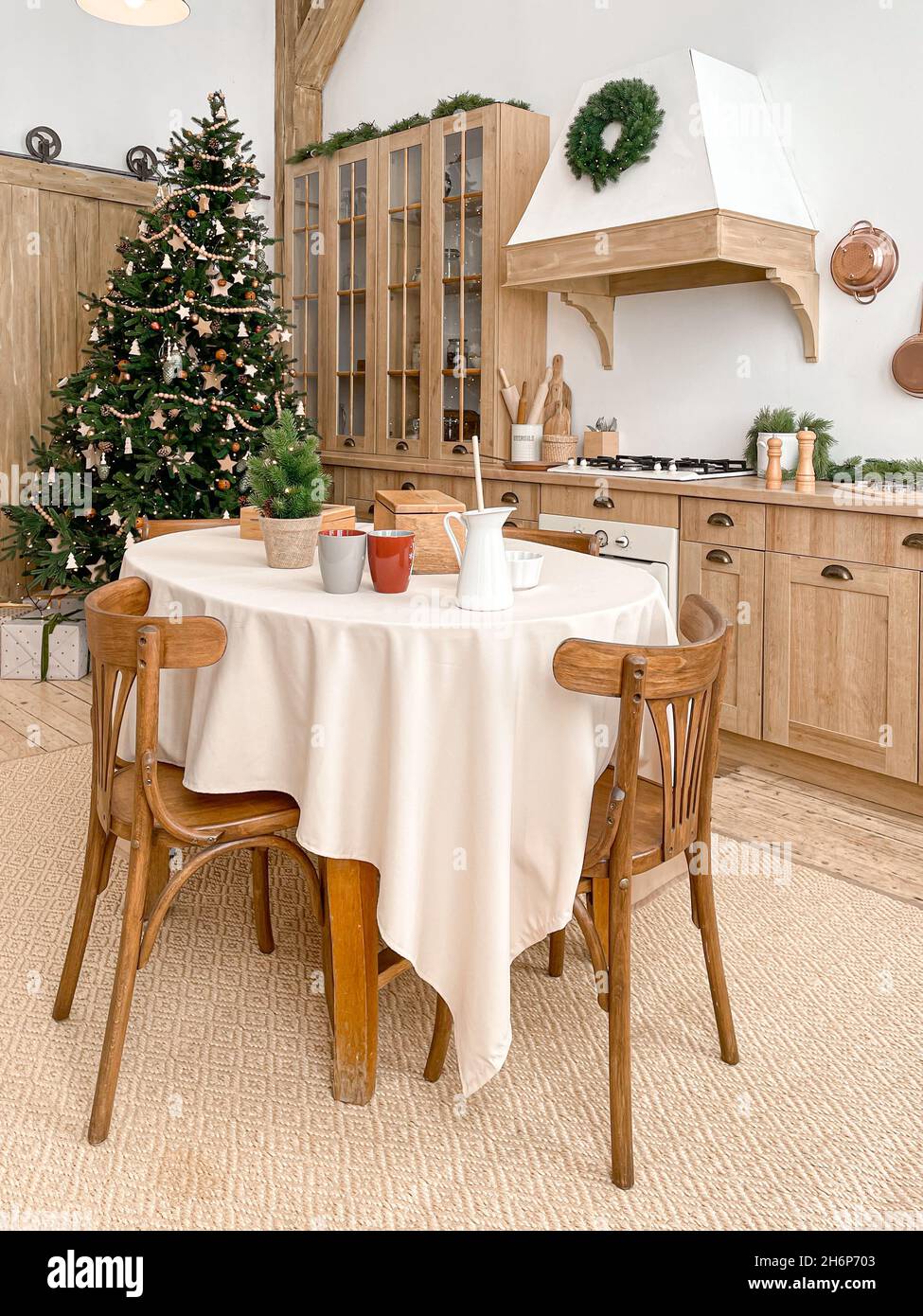 Festive christmas modern kitchen with big tree Stock Photo - Alamy