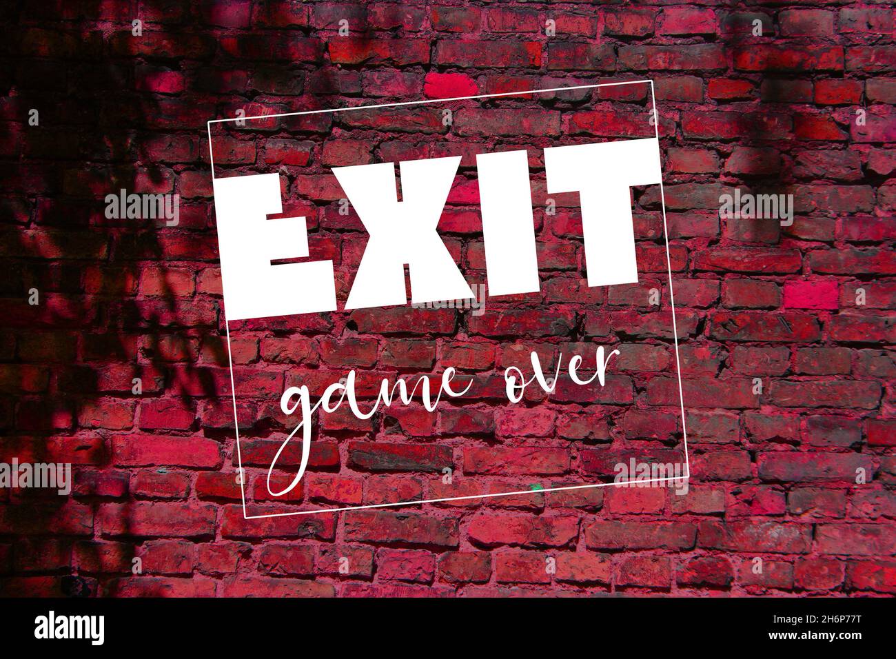 White exit word and game over. letters on brick wall. gaming concept ...