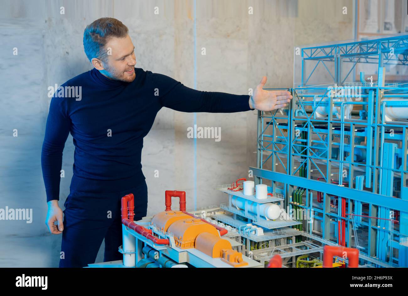 Young construction engineer man is studying layout of structure of ...