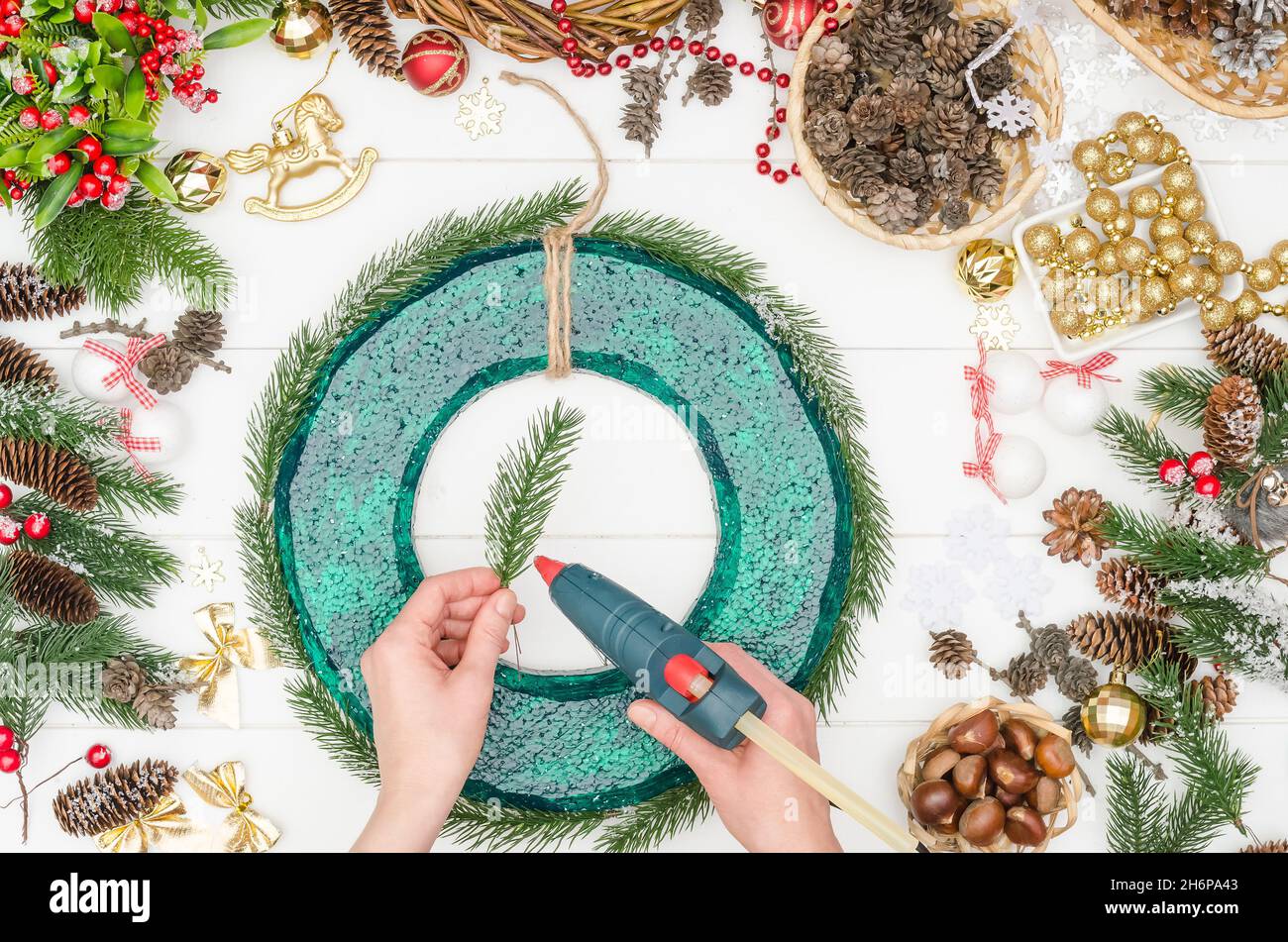Step-by-step making a large Christmas wreath, step 3 - glue the ...