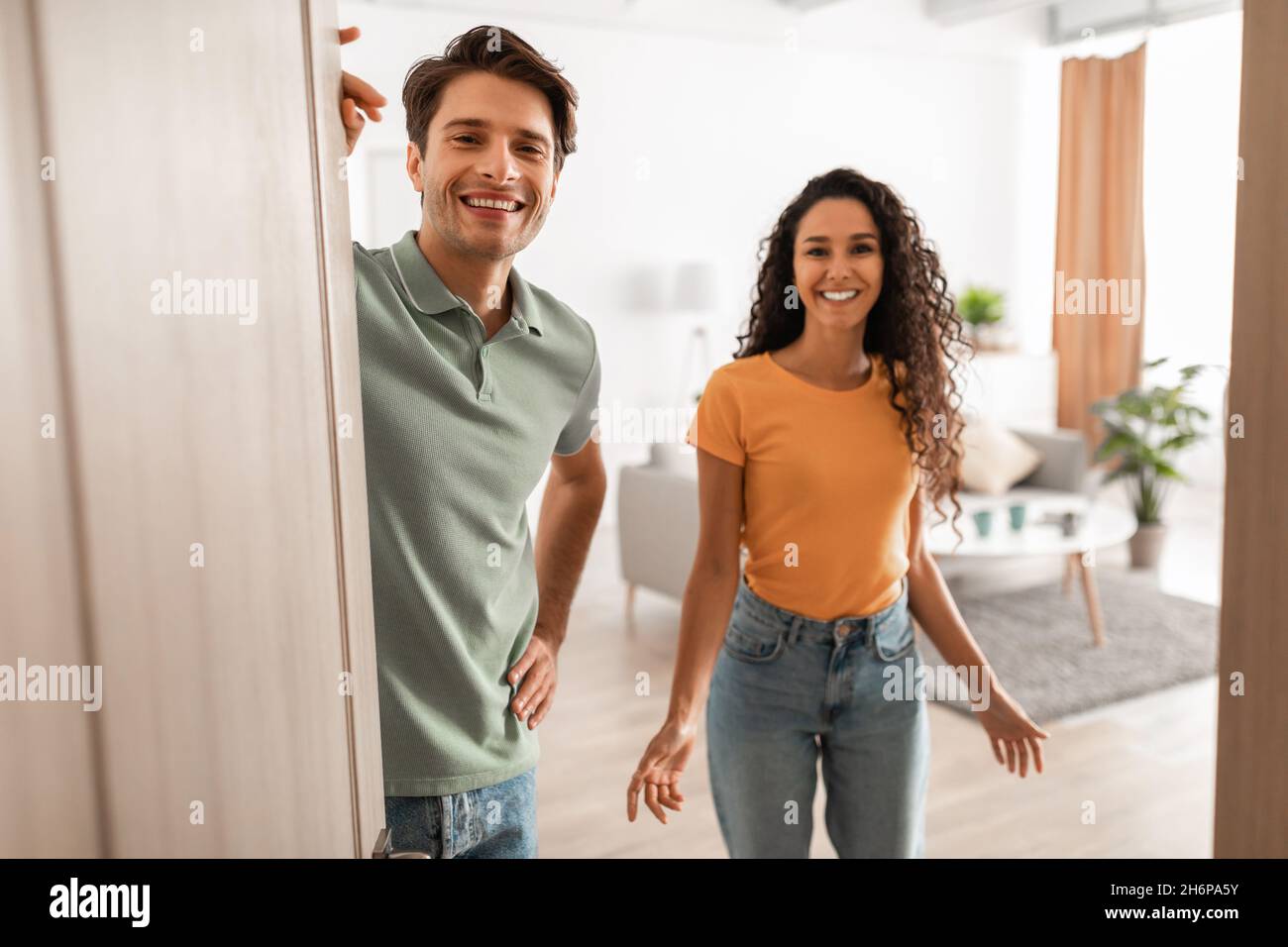 Man woman female couple entering front entrance hi-res stock ...