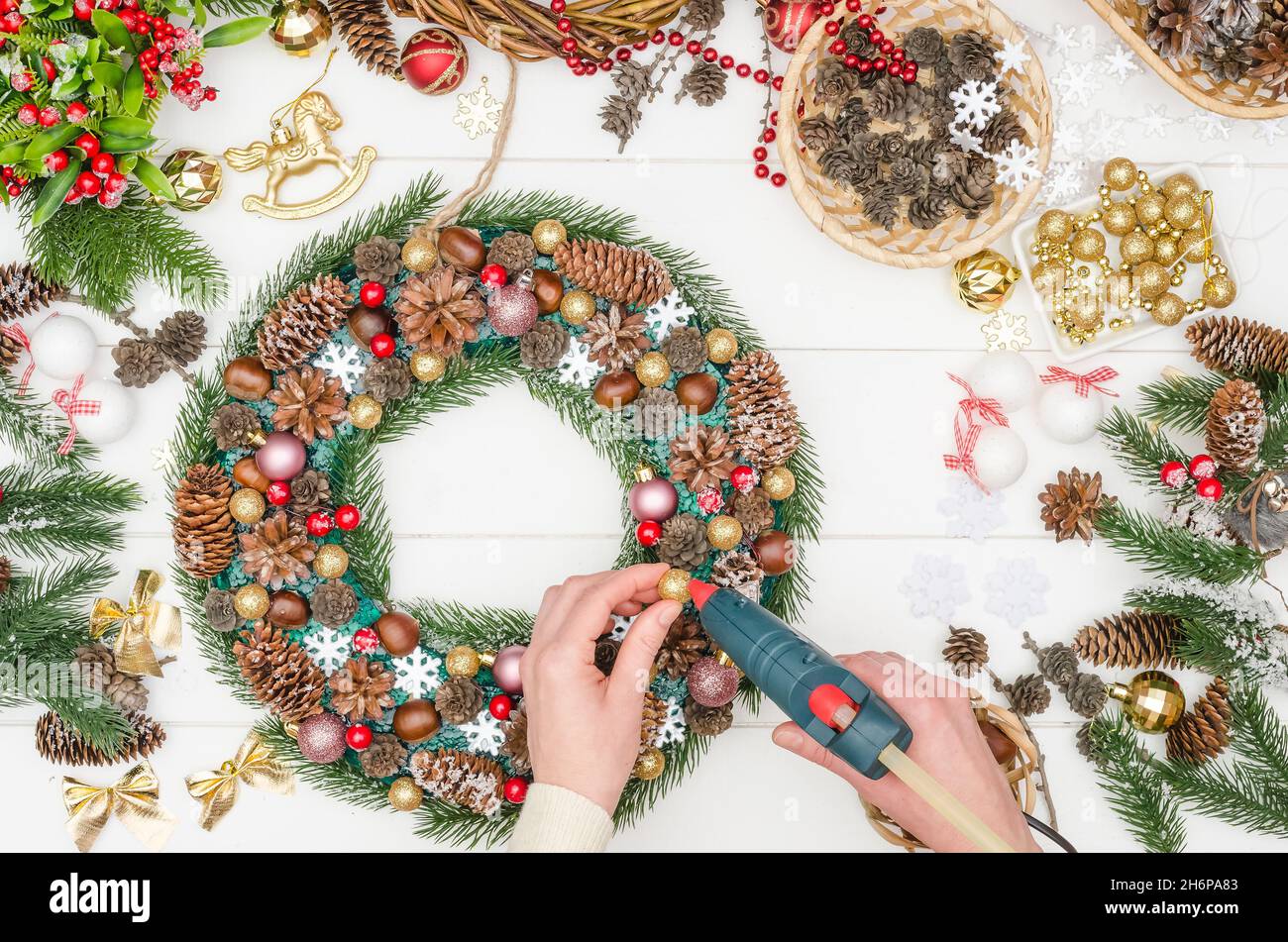 Step by step making a large Christmas wreath, step 16 - glue decorative ...