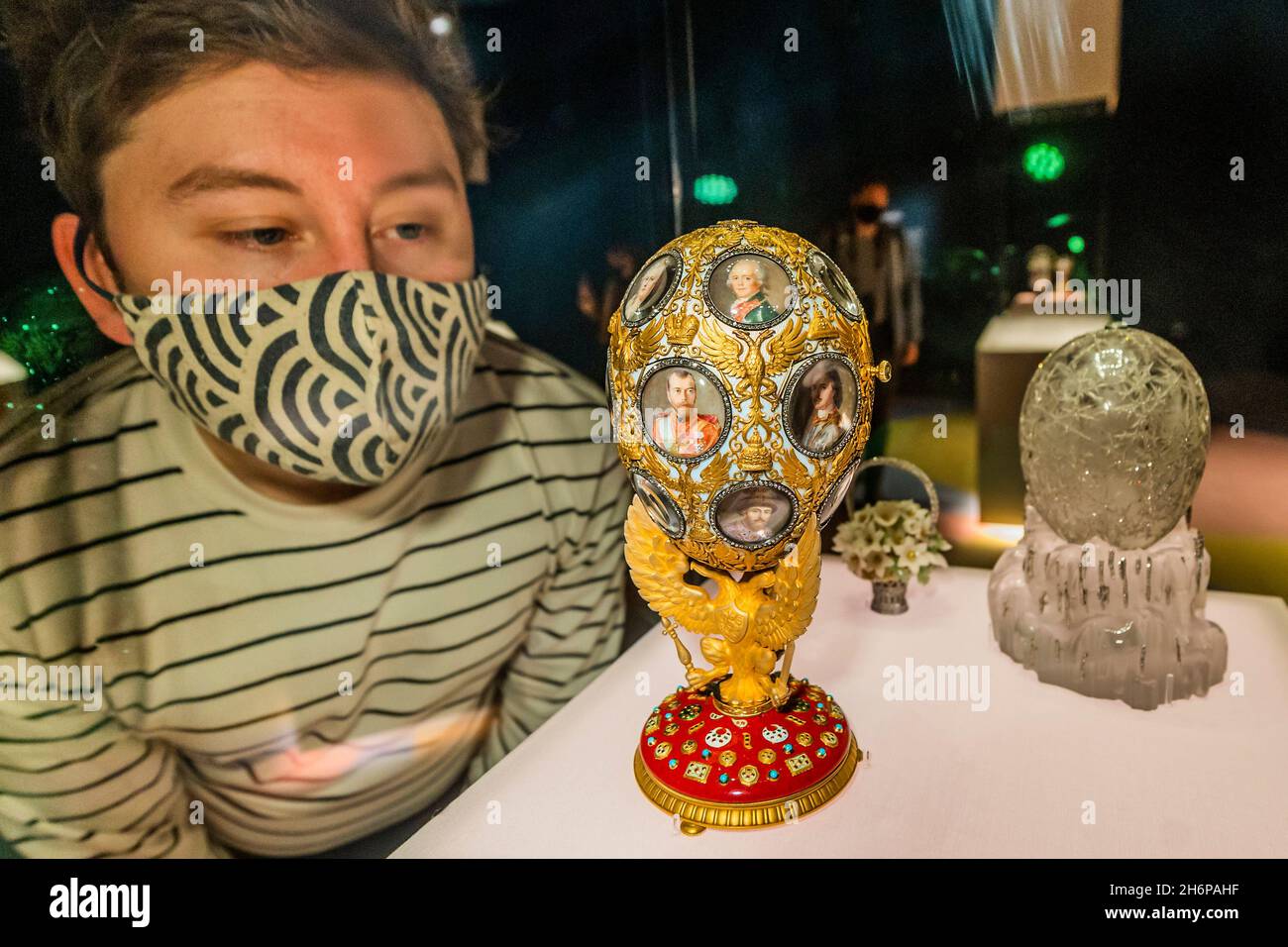 London, UK. 17th Nov, 2021. The Romanov Tercentenary egg with the Winter Egg - Fabergé in London ...