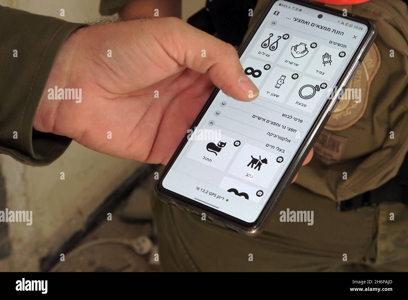 An Israeli Soldier from the rescue unit of the Home Front Command shows ...