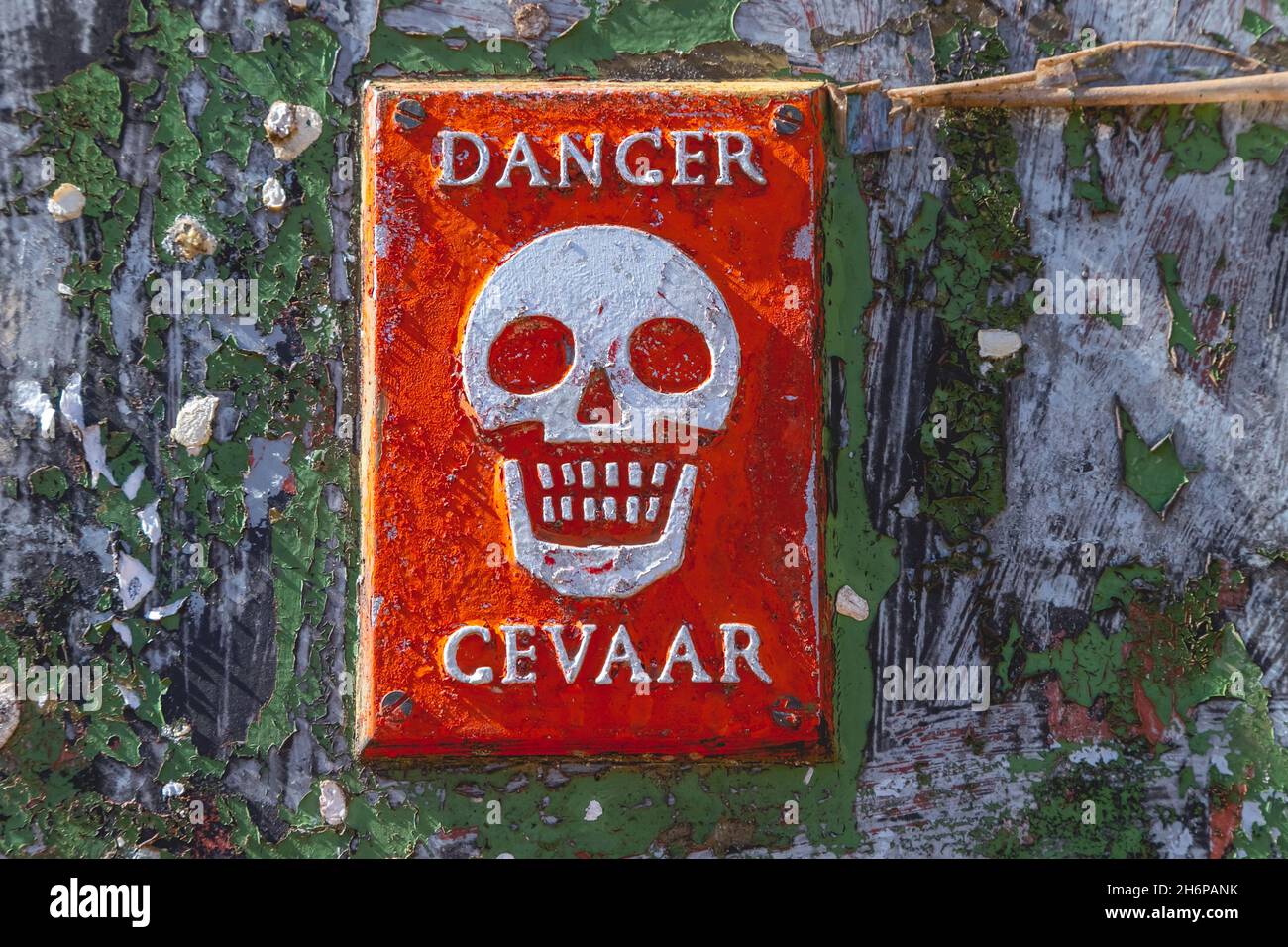 Danger sign on old wall. Danger sign with a scull Stock Photo - Alamy