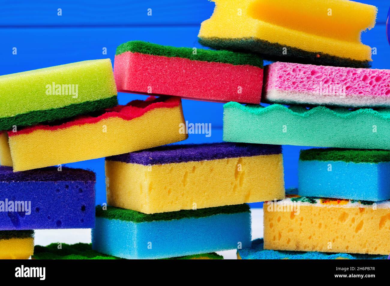 Pile of new multicolored cleaning sponges, close up Stock Photo - Alamy
