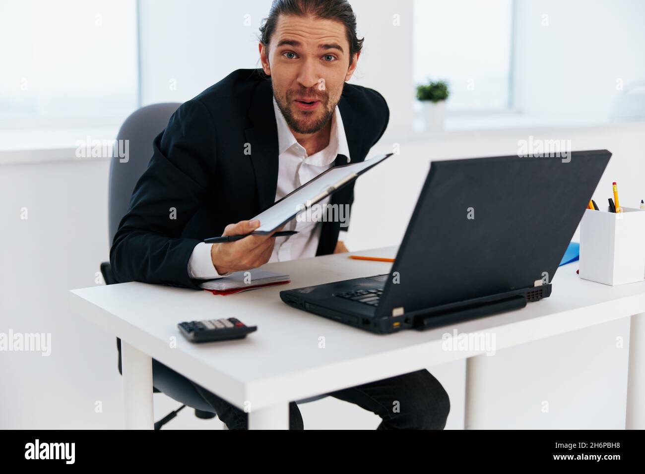 Man workflow in the office documents emotions boss Stock Photo - Alamy