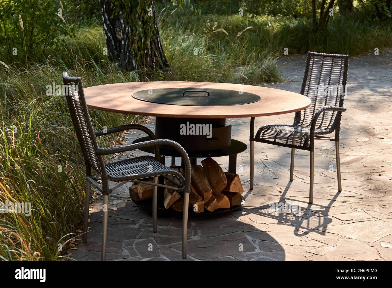 Kettle Grill Pit with Cast Iron Grid. Round table-cooking surface with ...