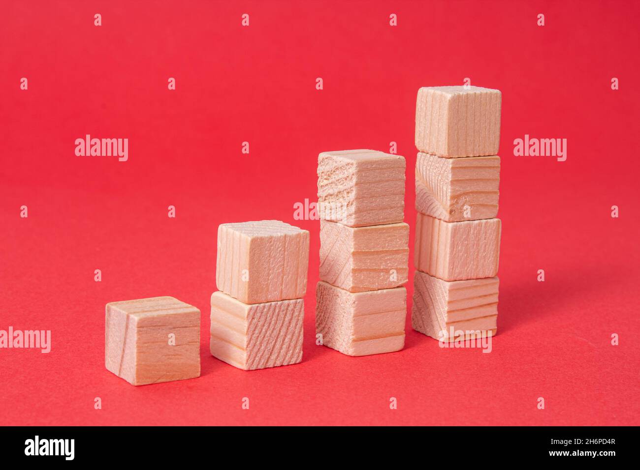 Wooden cubes without icons on a red background Stock Photo - Alamy