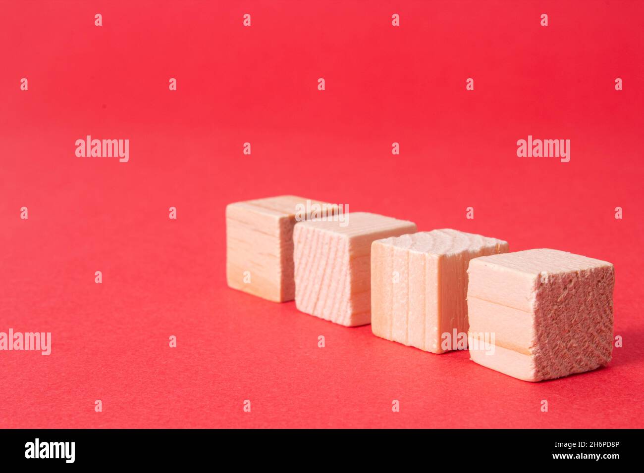 Wooden cubes without icons on a red background Stock Photo - Alamy