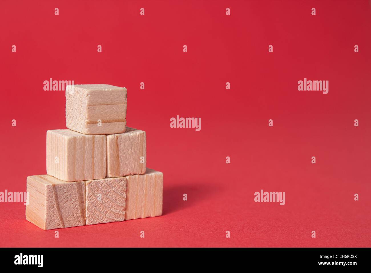 Wooden cubes without icons on a red background Stock Photo - Alamy