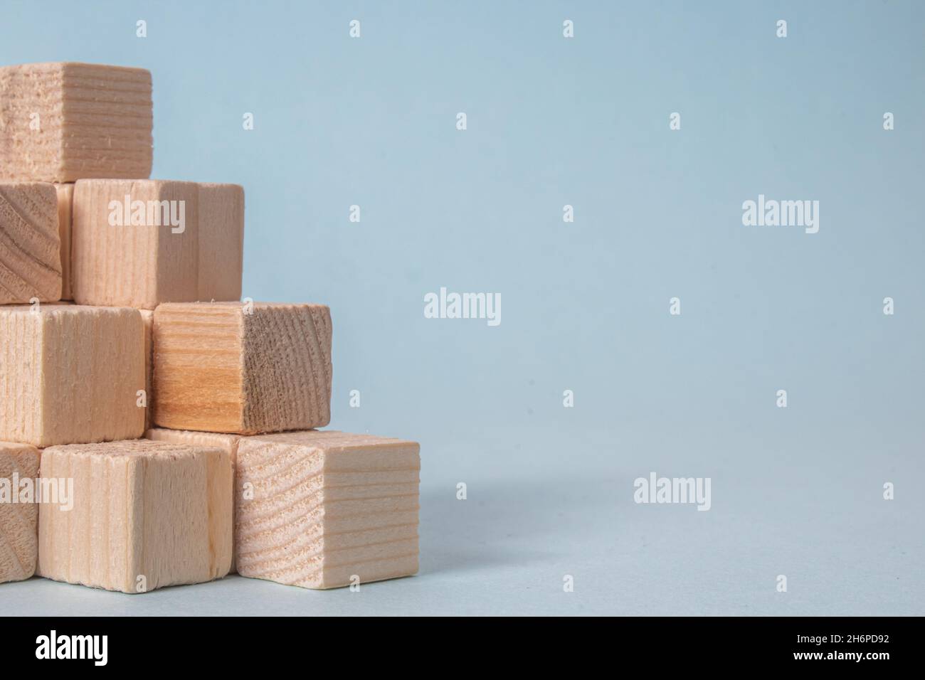 Wooden cubes without icons on a blue background Stock Photo - Alamy