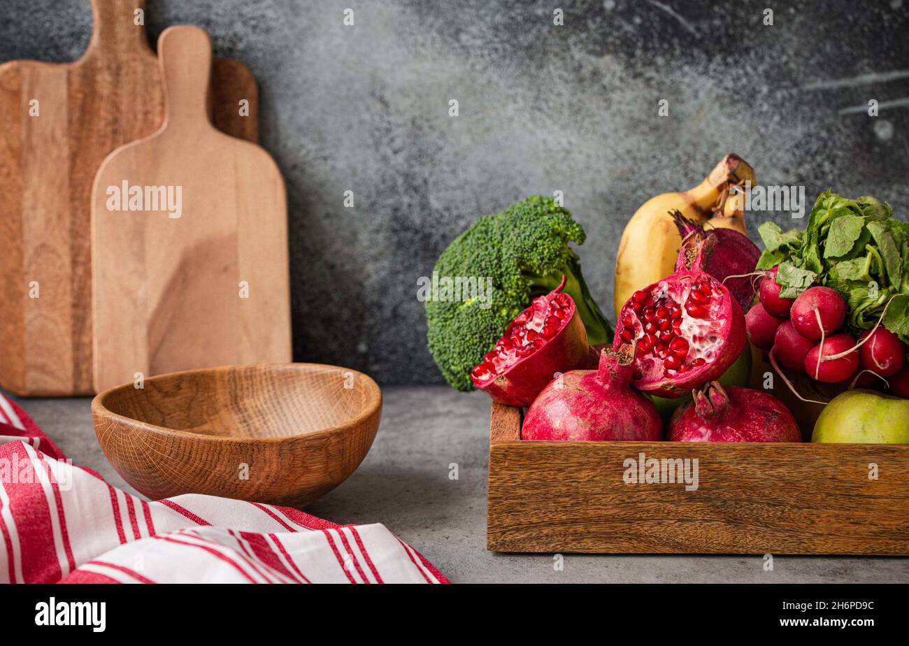 Kitchen table with empty bowl, fruit and vegetables Stock Photo - Alamy