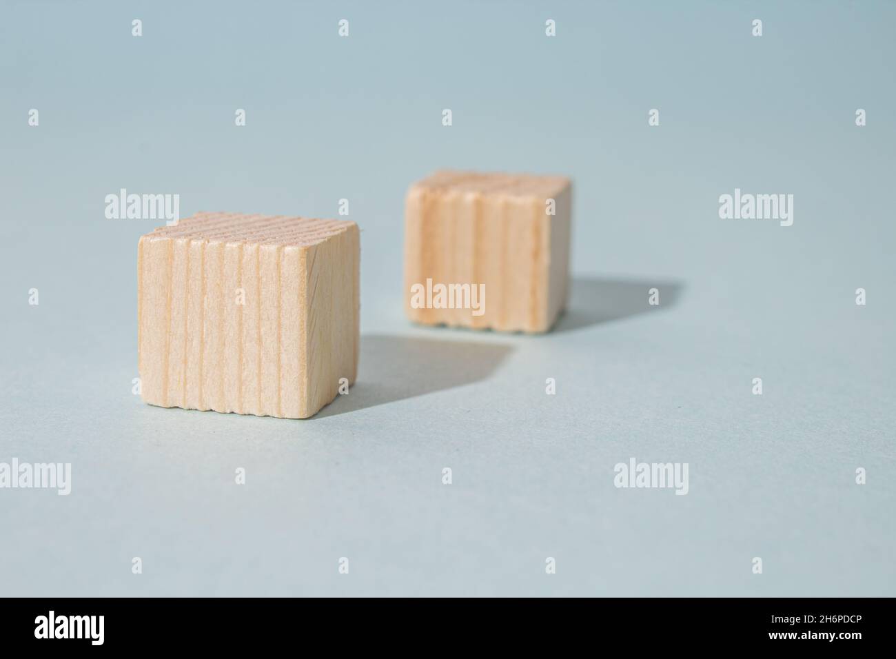 Wooden cubes without icons on a red background Stock Photo - Alamy