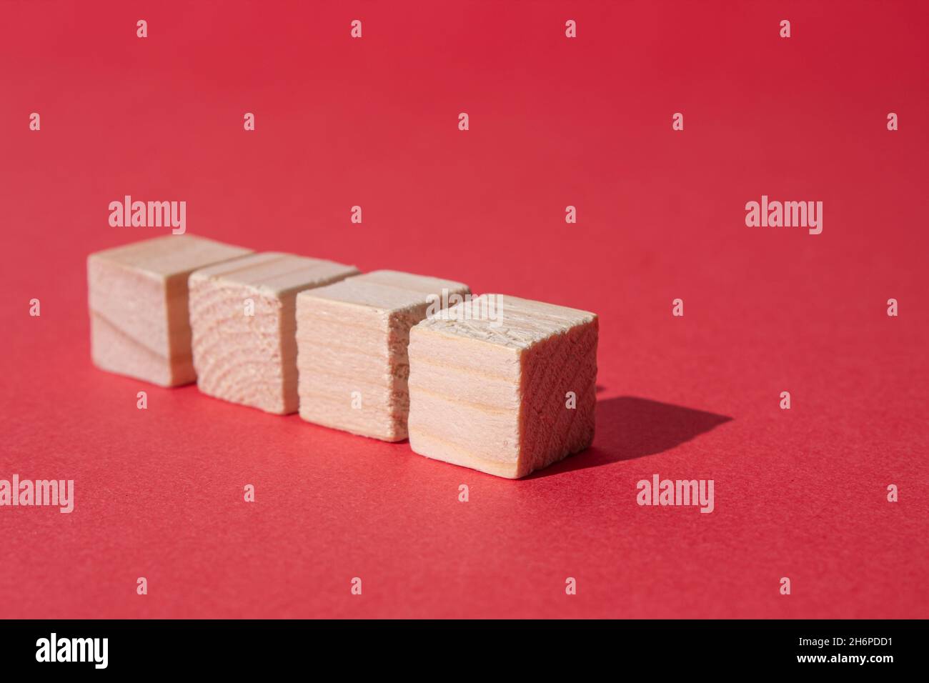 Wooden cubes without icons on a red background Stock Photo - Alamy