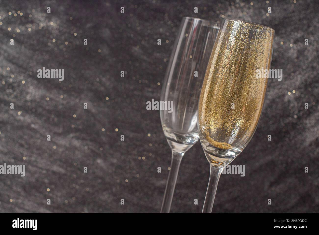 Closeup of champagne glasses with golden powder Stock Photo - Alamy