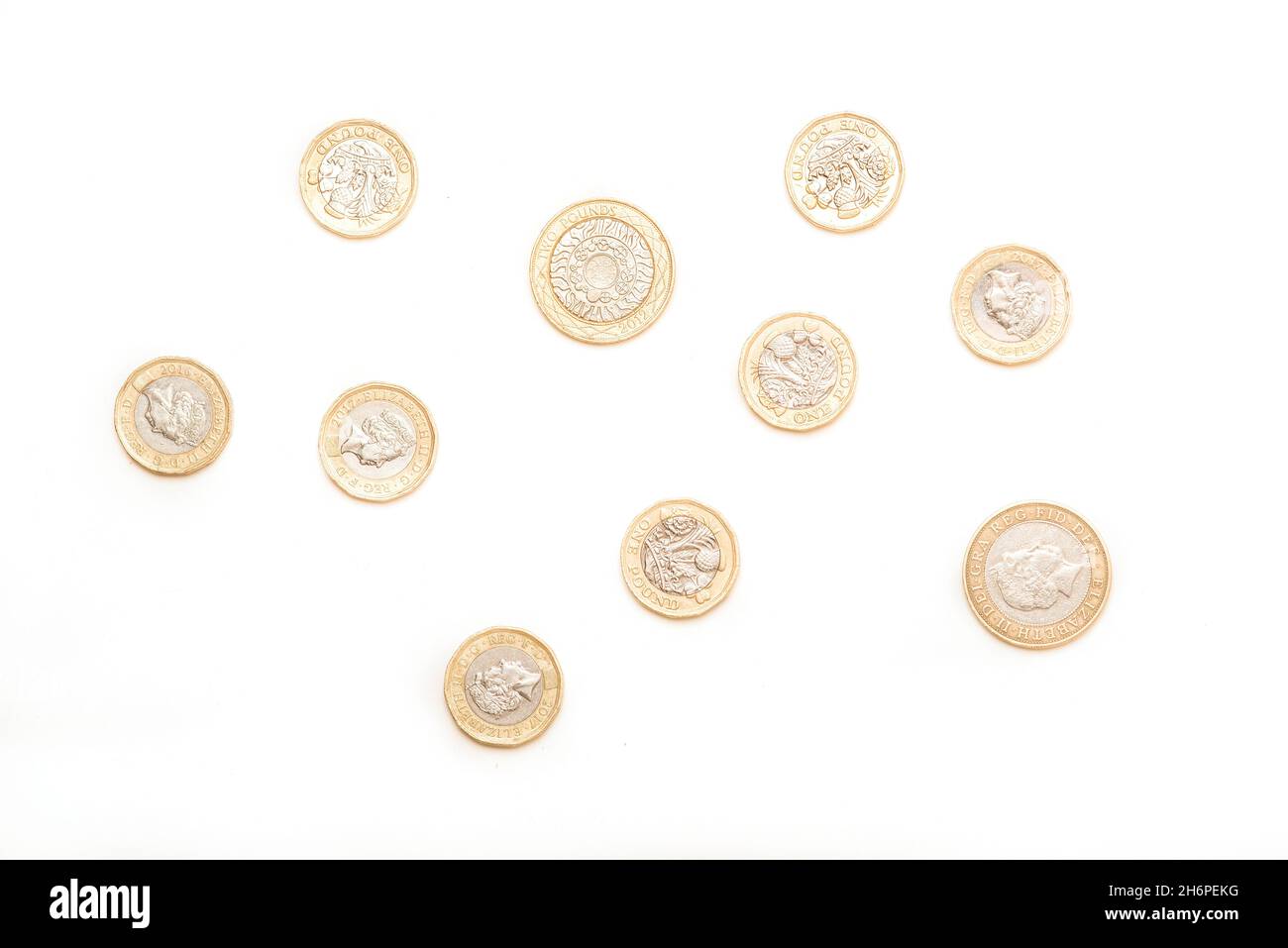 Money: Close up of One pound coins. Pound Sterling currency on white ...