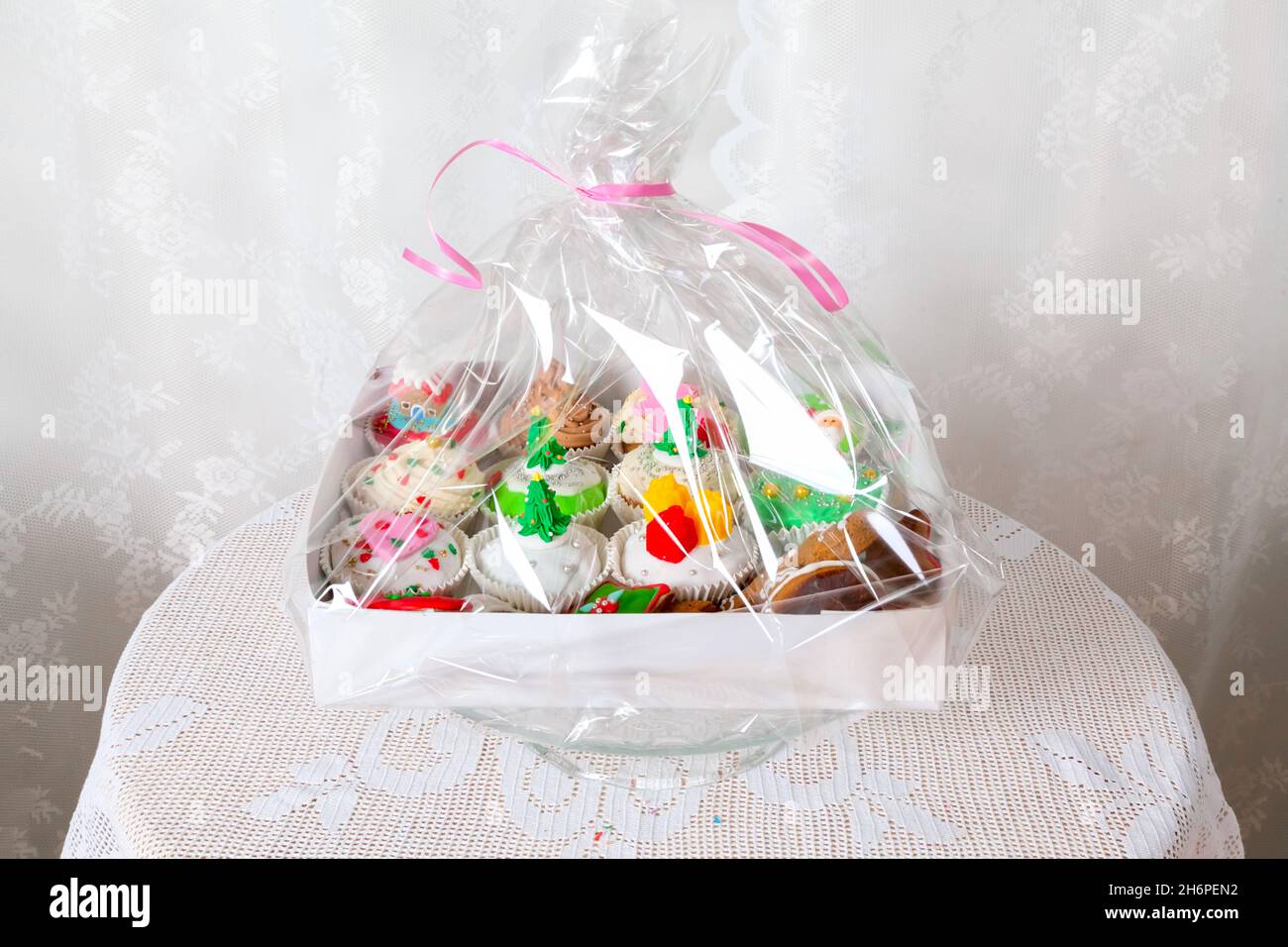 A gift box with homemade cakes, cupcakes, muffins decorated in a ...