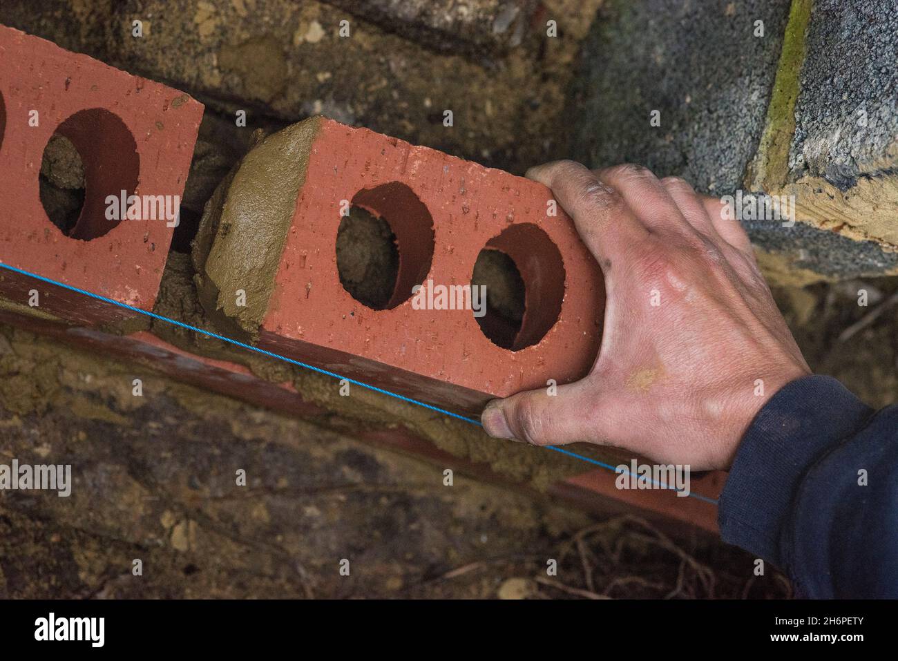 Bricklaying engineering bricks. Occupation: Bricklayer. Construction ...