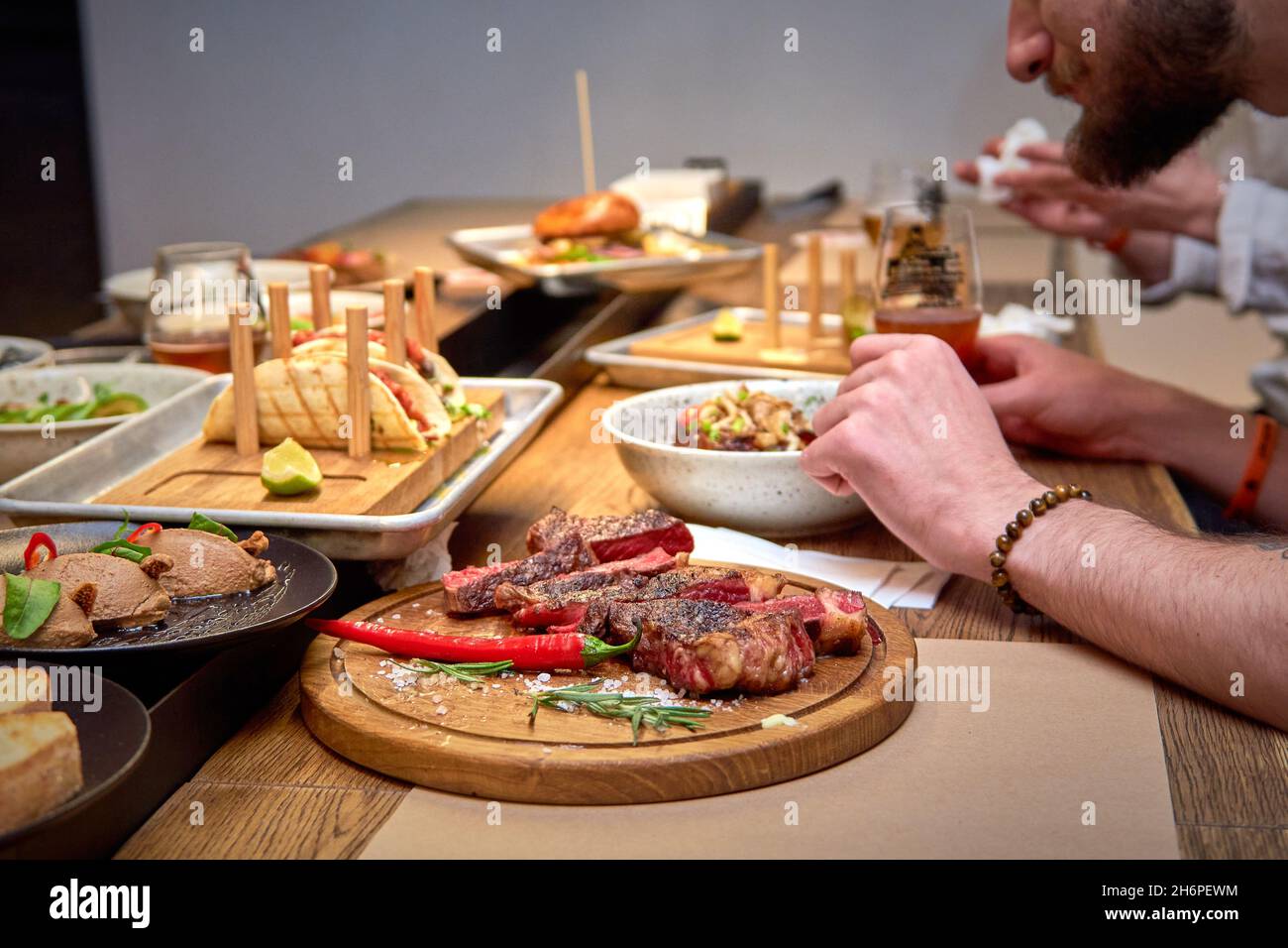 Delicious dinner in restaurant on a wooden table, no people are visible ...