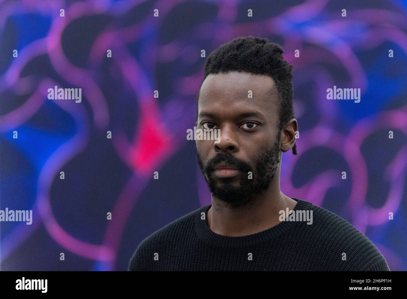 London, UK. 17 November 2021. Artist Tunji Adeniyi-Jones poses with his ...
