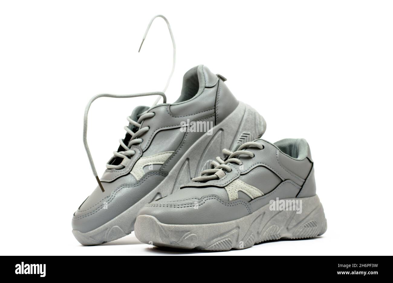 Beige women's sneakers on a white background. Levitating sneaker with ...