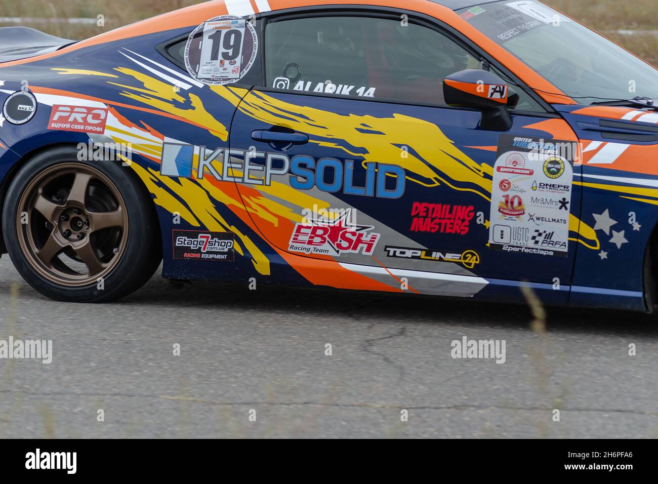 The Subaru BRZ sports car drives down the road at high speed. Side view ...