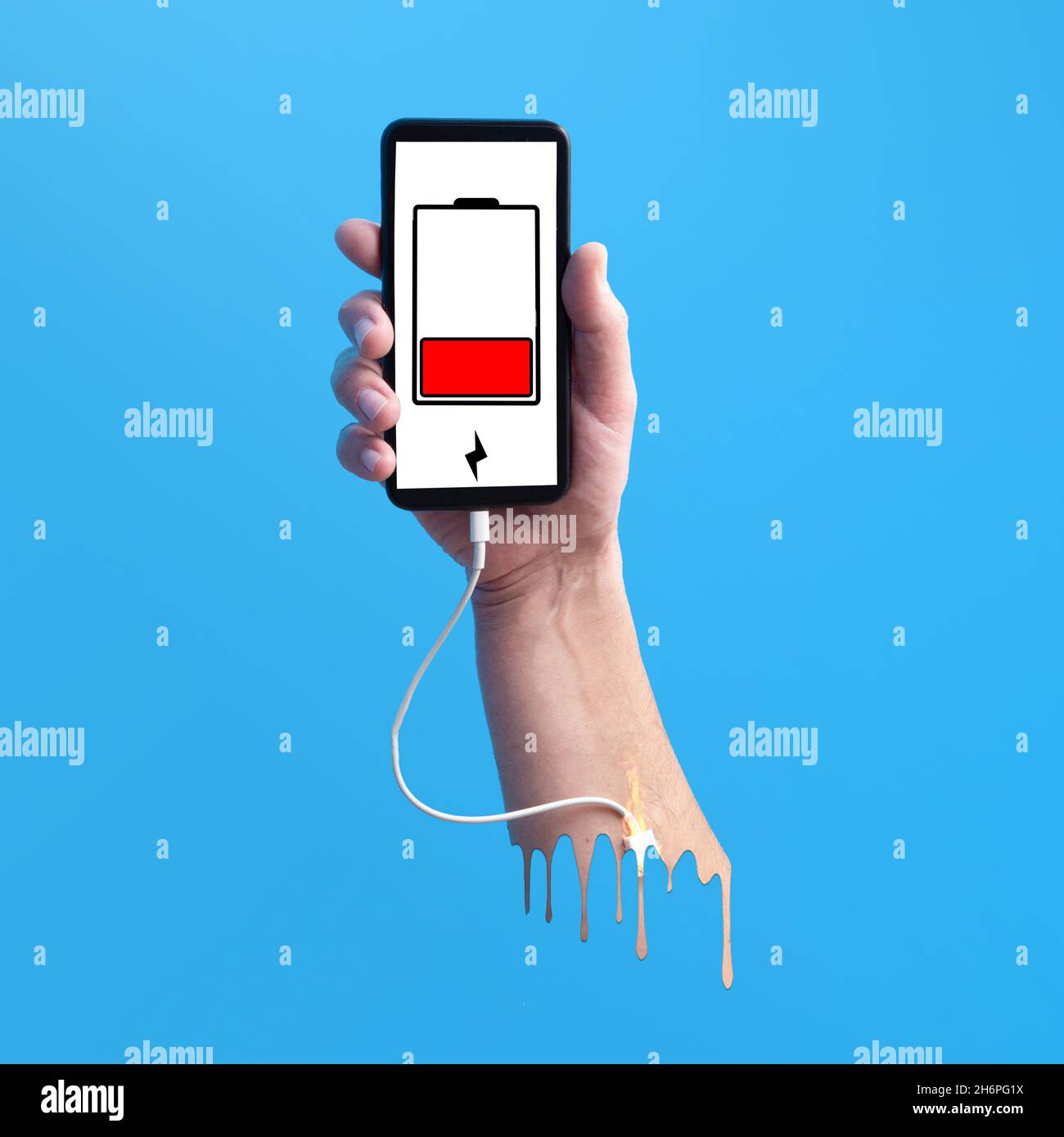 Smartphone charging in the melting hand, against blue background Stock ...
