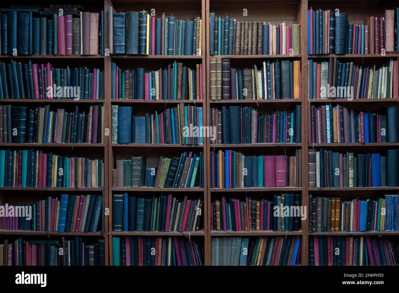 Bookshelf background. Front view old books inside the library Stock ...