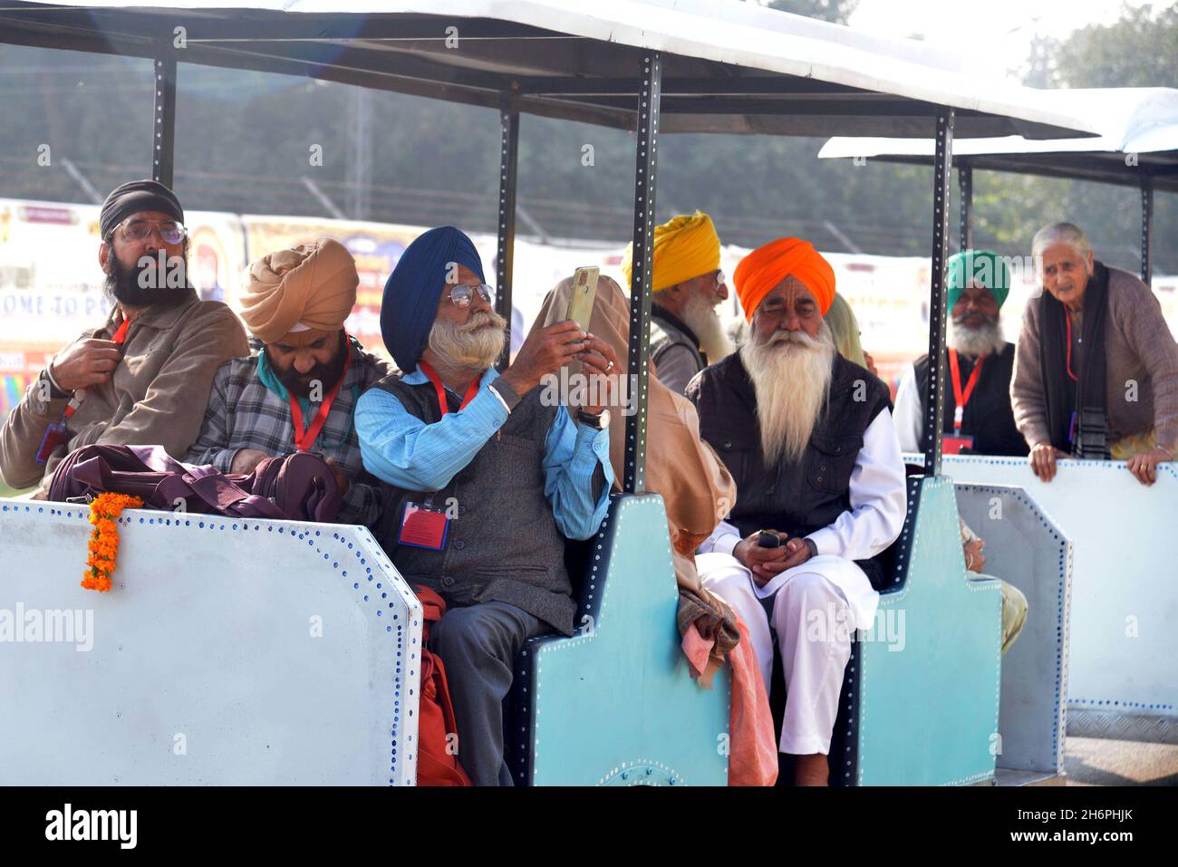 Lahore, Punjab, Pakistan. 17th Nov, 2021. Indian Sikh pilgrims wave to ...