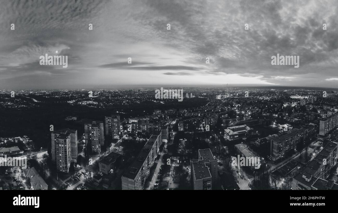 Night lights on streets of residential district and moody cloudy sky ...